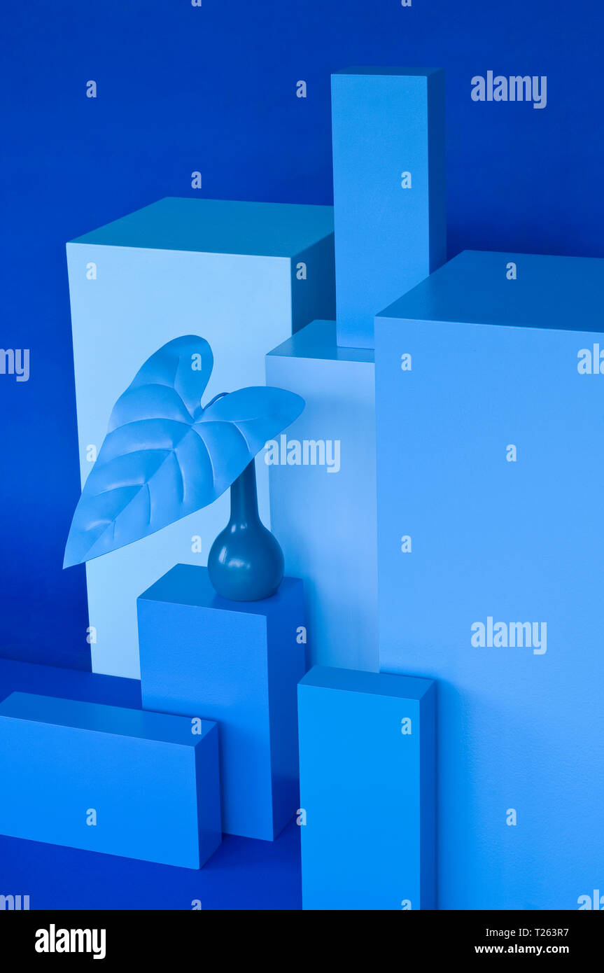 Various cuboids, blue vase with blue leave Stock Photo - Alamy
