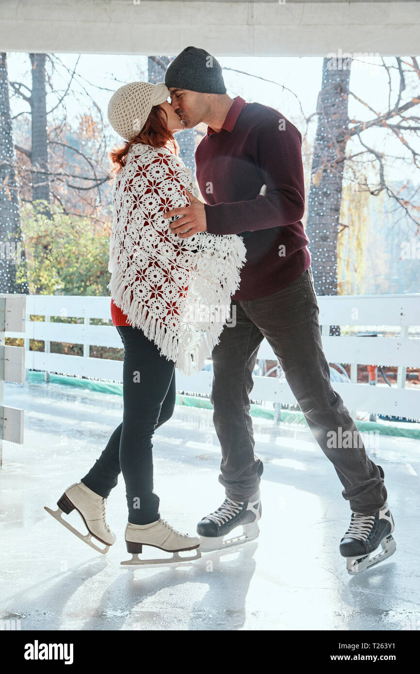 Couple kissing on the ice rink Stock Photo - Alamy
