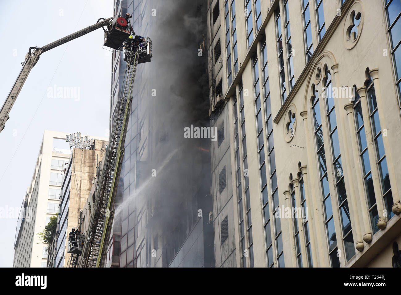 Bangladeshi Firefighters try to control fire in office building in ...