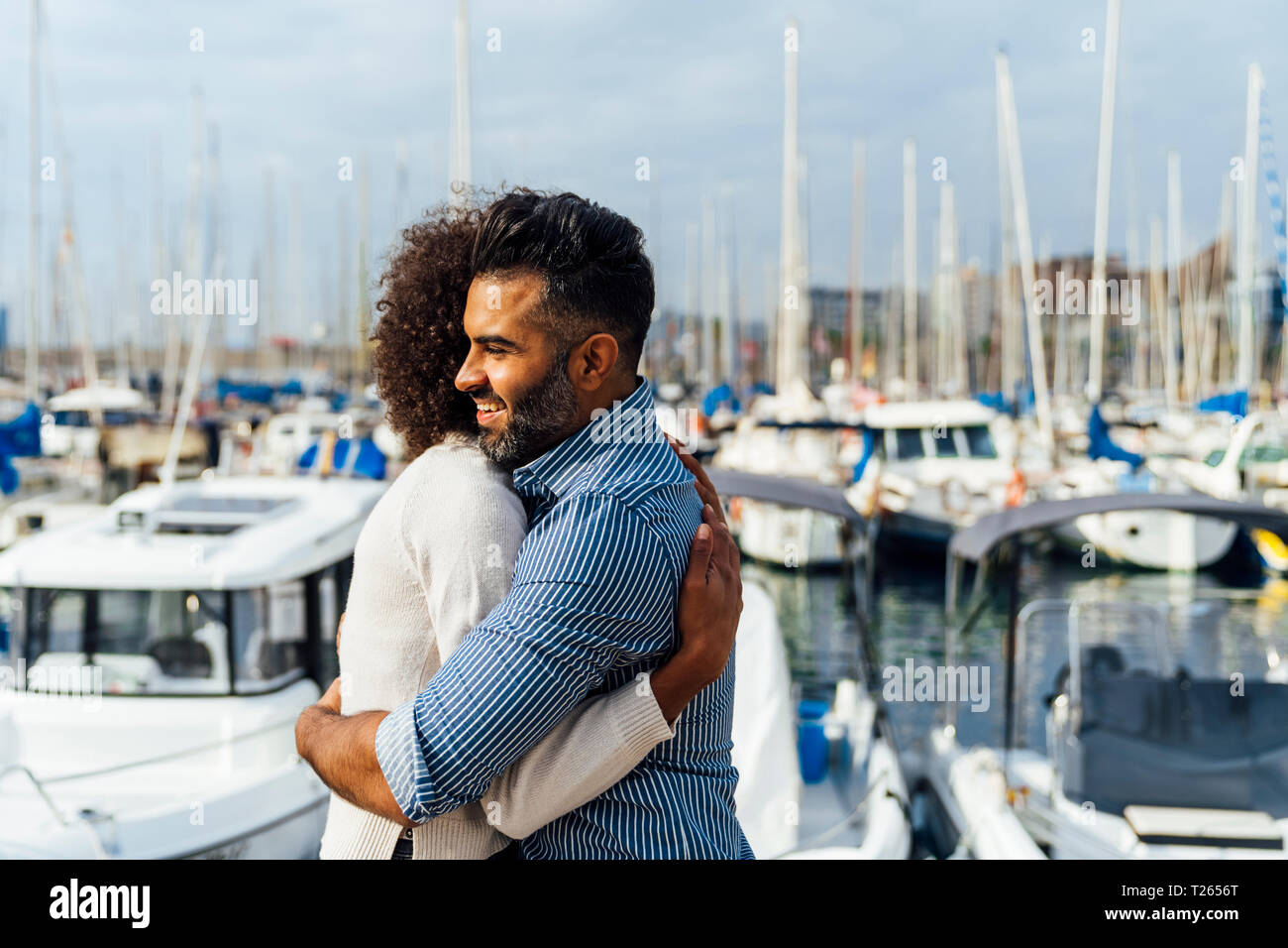 Spain, Barcelona, happy couple hugging at the marina Stock Photo - Alamy