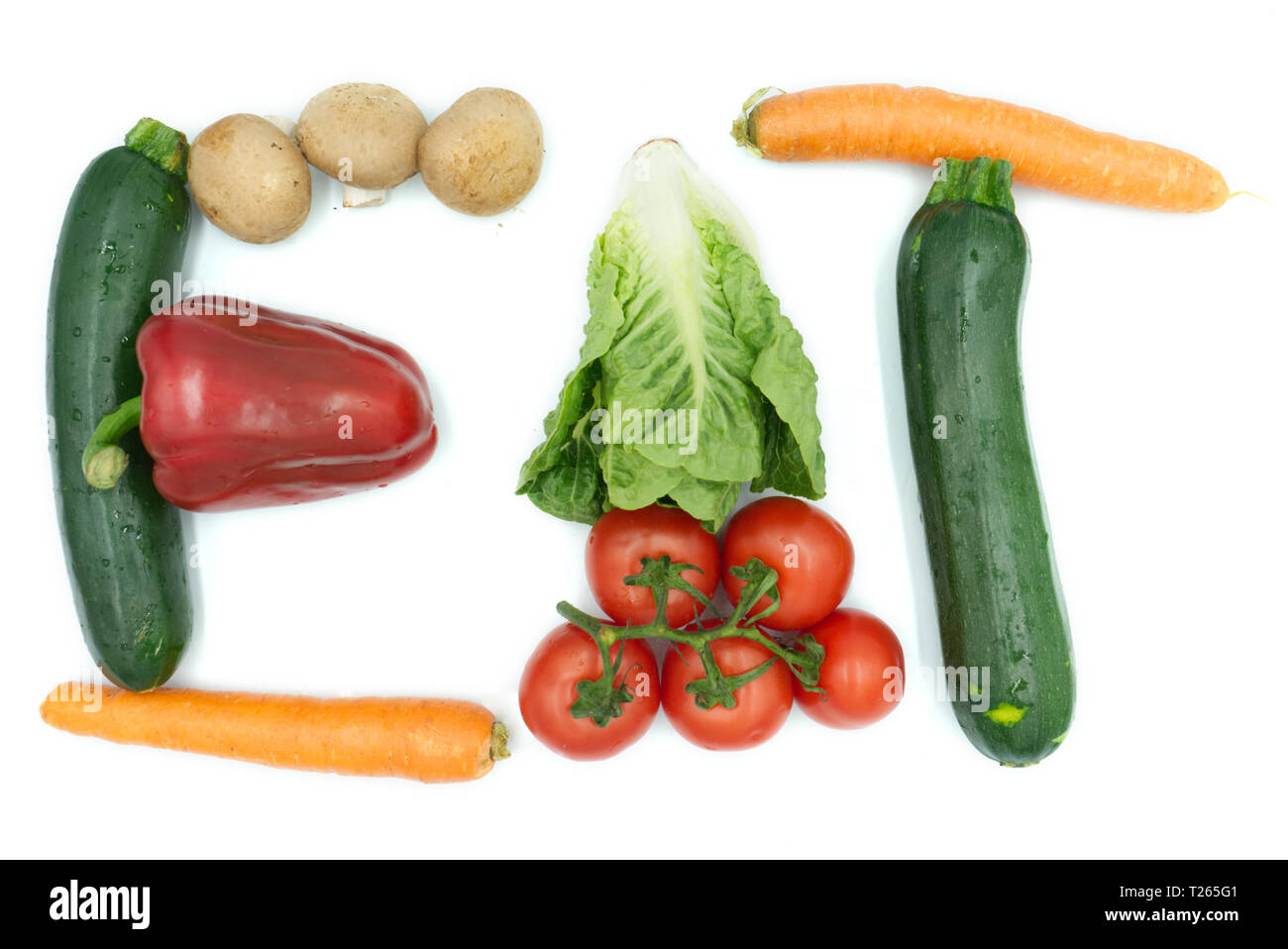 word 'EAT' written with colorful vegetables on white background Stock ...