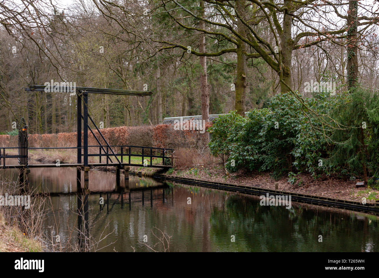 A metallic bridge over the water canal in Heeze castle,Netherlands ...