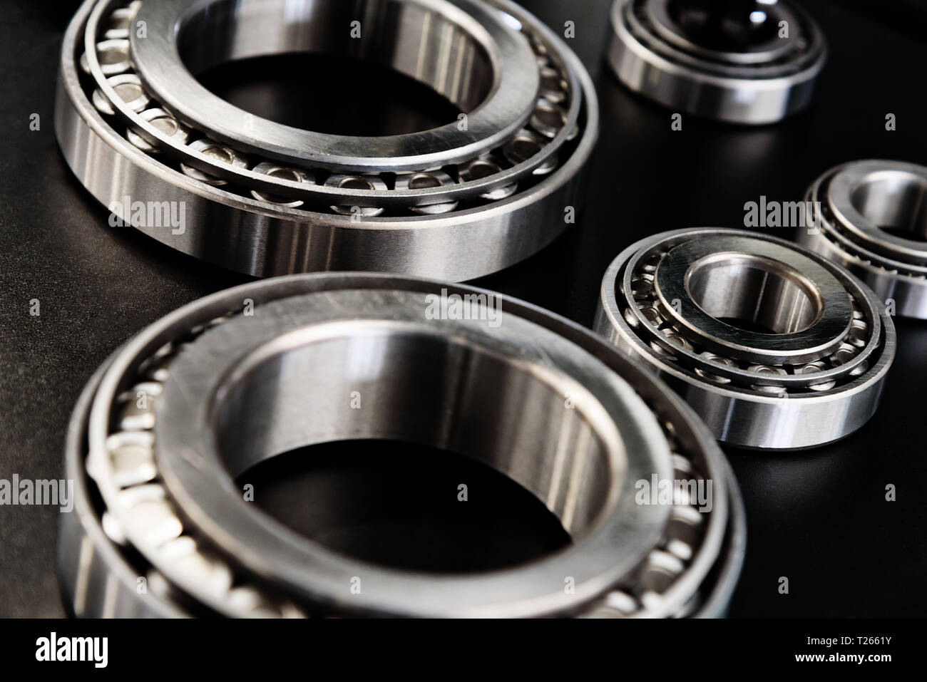 Full frame industrial background - metal bearings in close-up on a ...