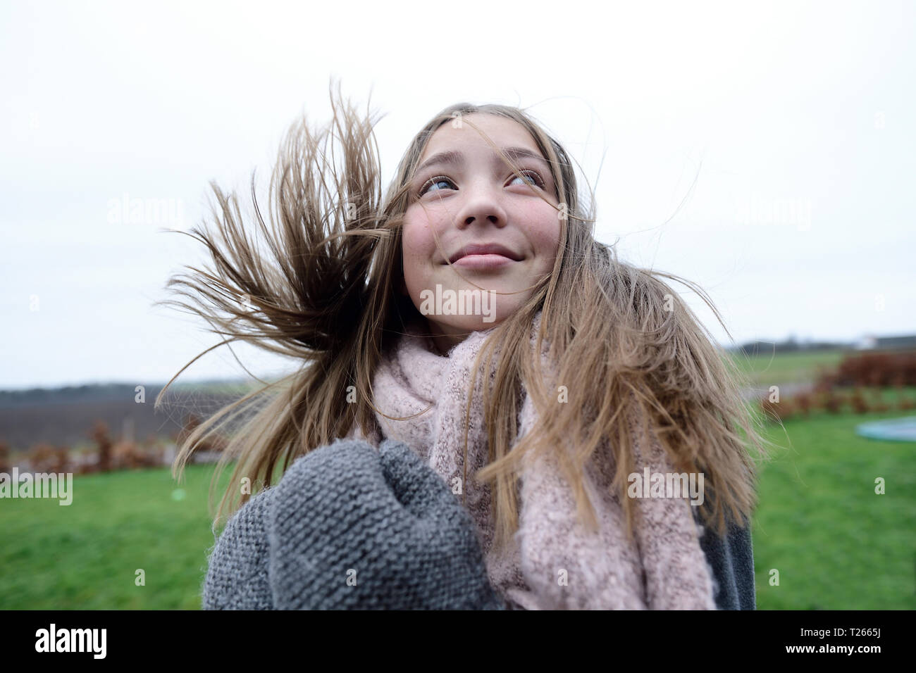 Portrait smiling girl blowing hi-res stock photography and images - Alamy