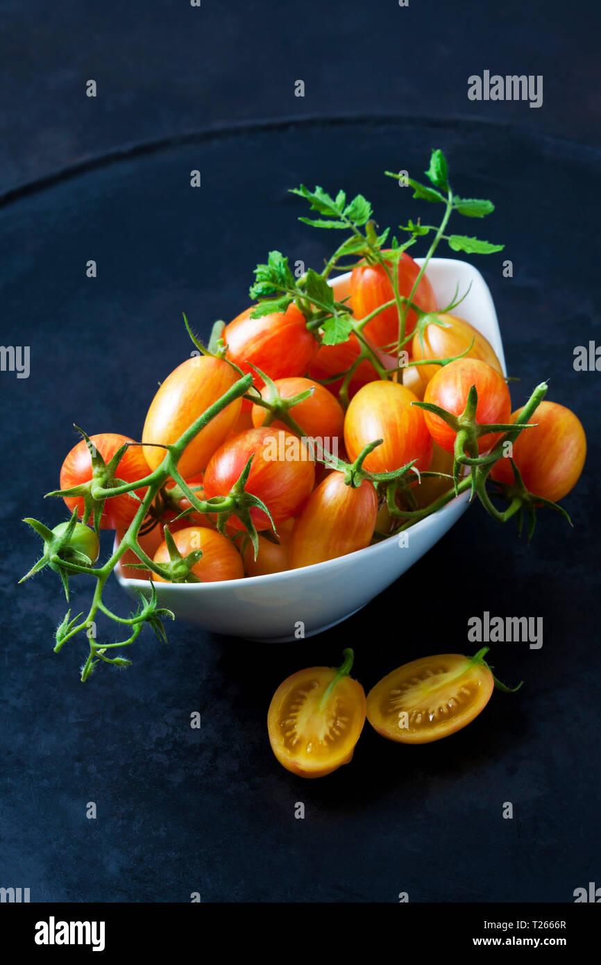 Bowl of cocktail tomatoes 'Artisan Blush Tiger' Stock Photo - Alamy