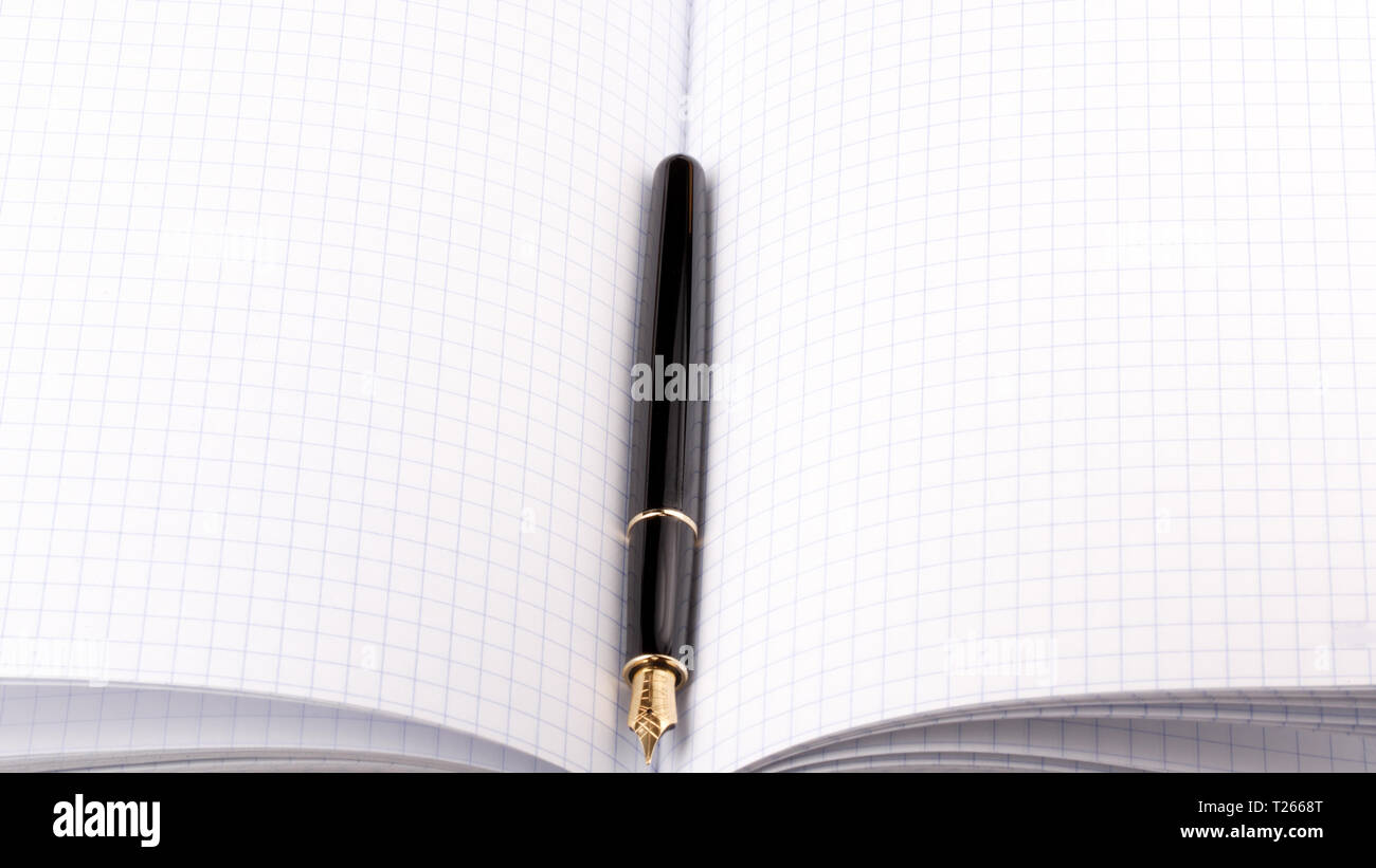 fountain pen on paper notebook Stock Photo - Alamy