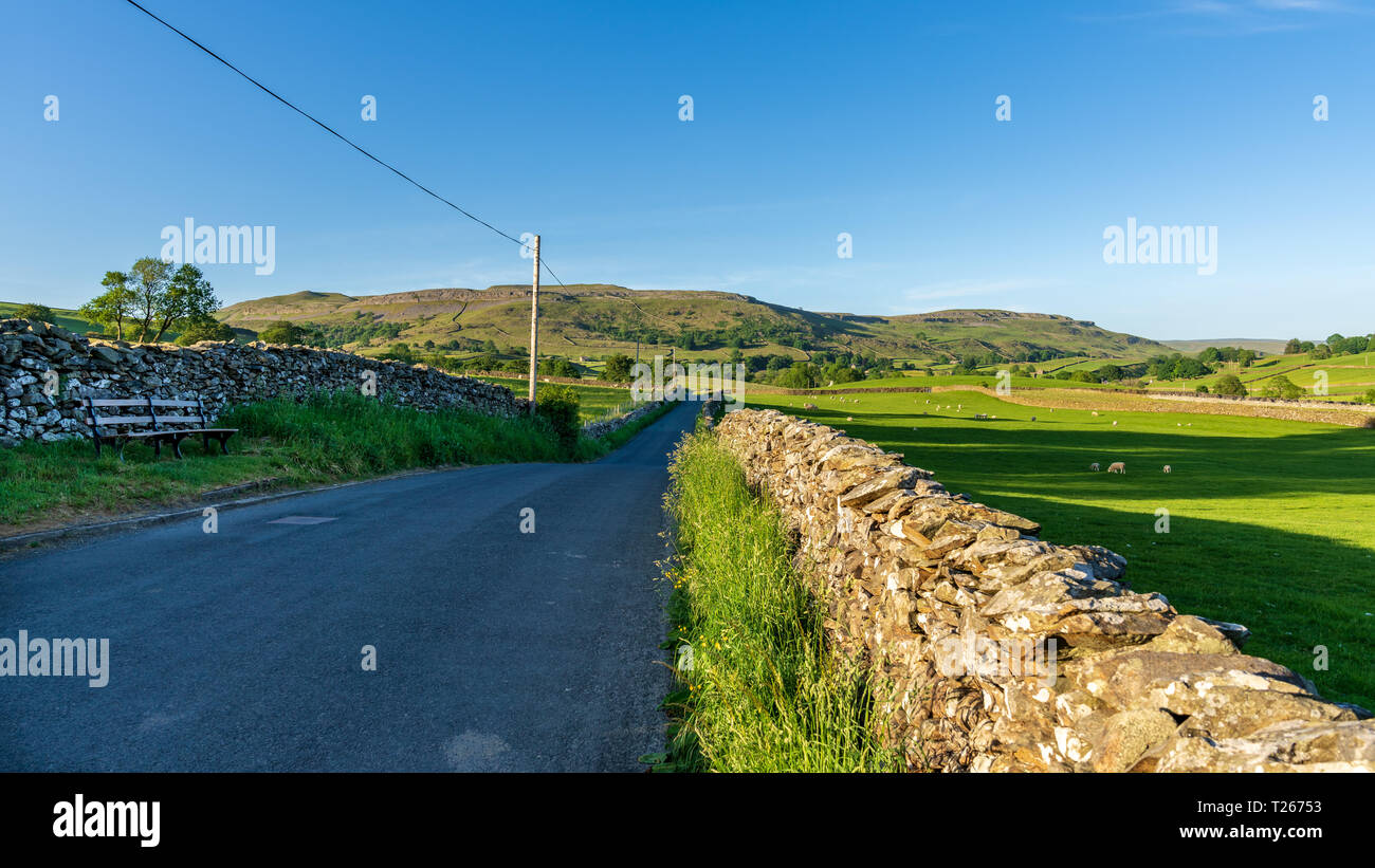 Rural road in the Yorkshire Dales near Austwick, North Yorkshire ...