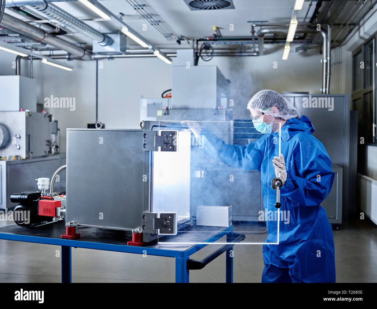 Chemist working in industrial laboratory clean room Stock Photo - Alamy
