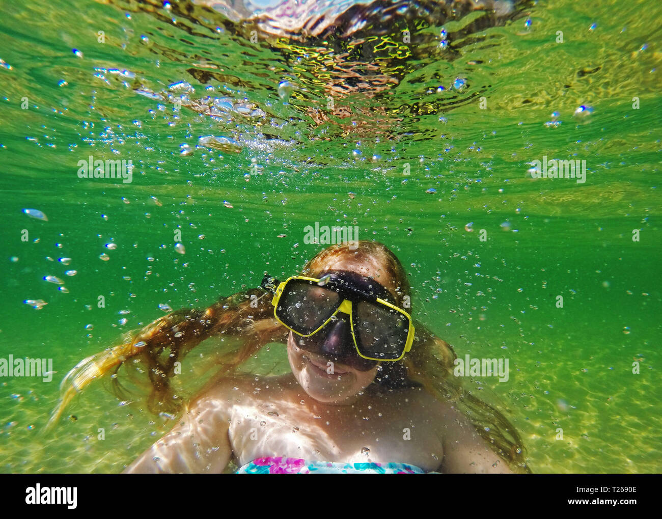 Girl diving into lake hi-res stock photography and images - Alamy