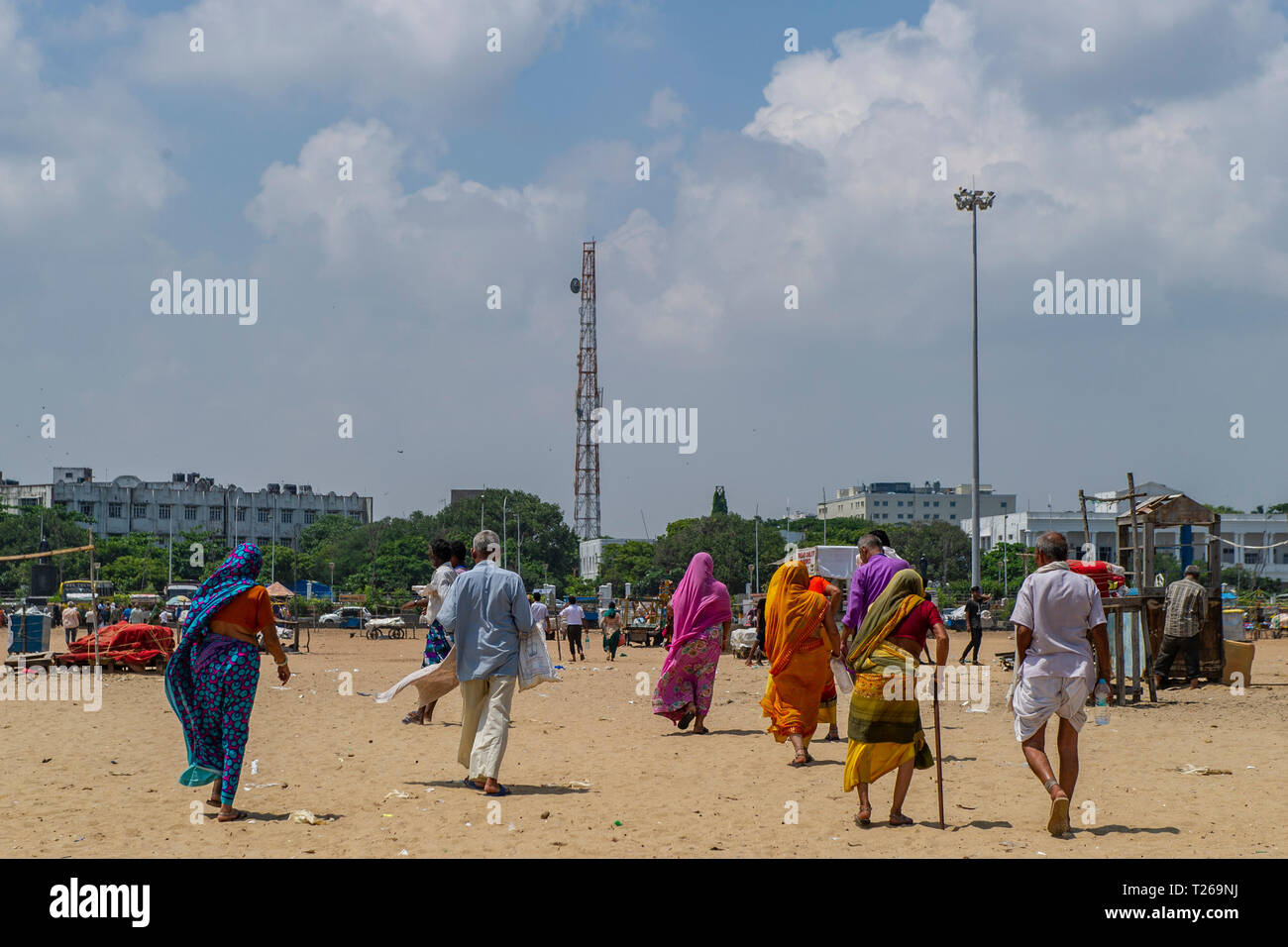 Crowds of people enjoy the sea at Marina Beach, on the Bay of Bengal in ...