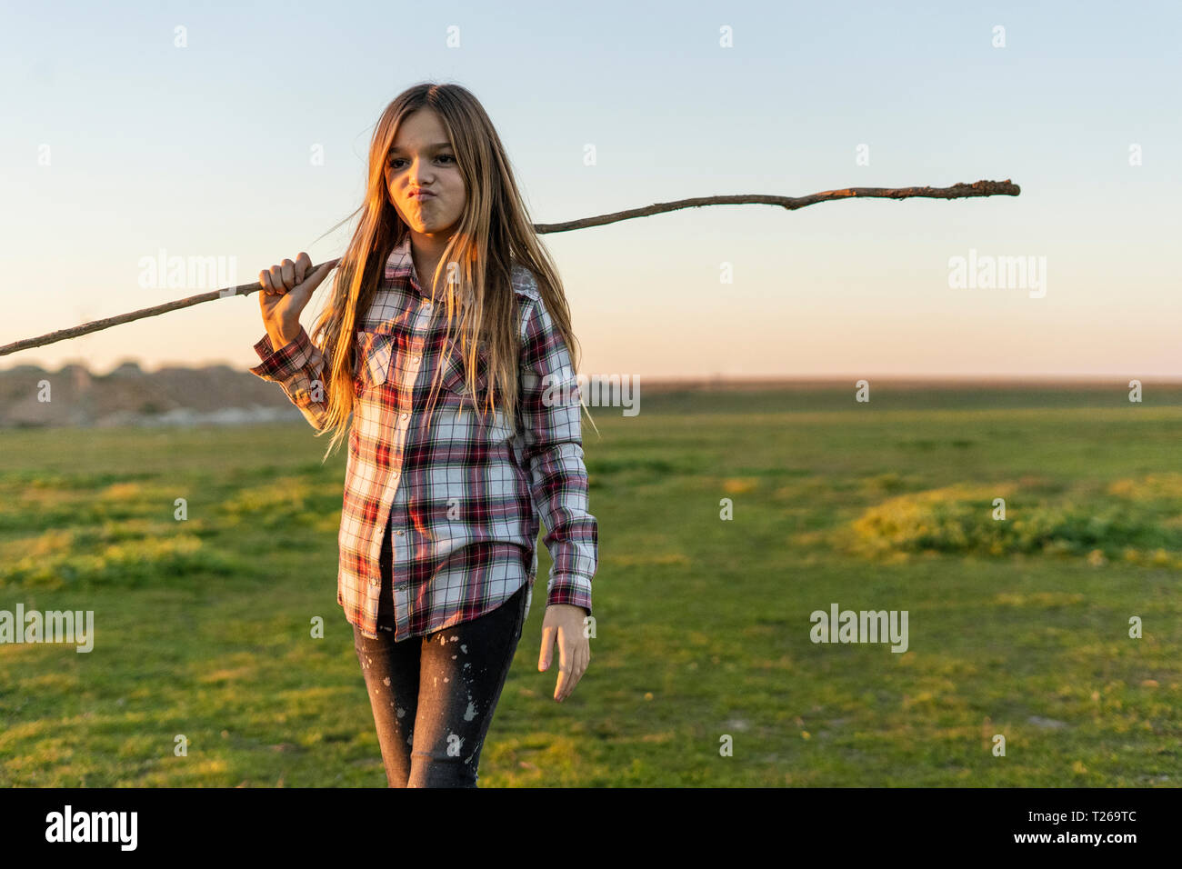 Girl with stick hi-res stock photography and images - Alamy