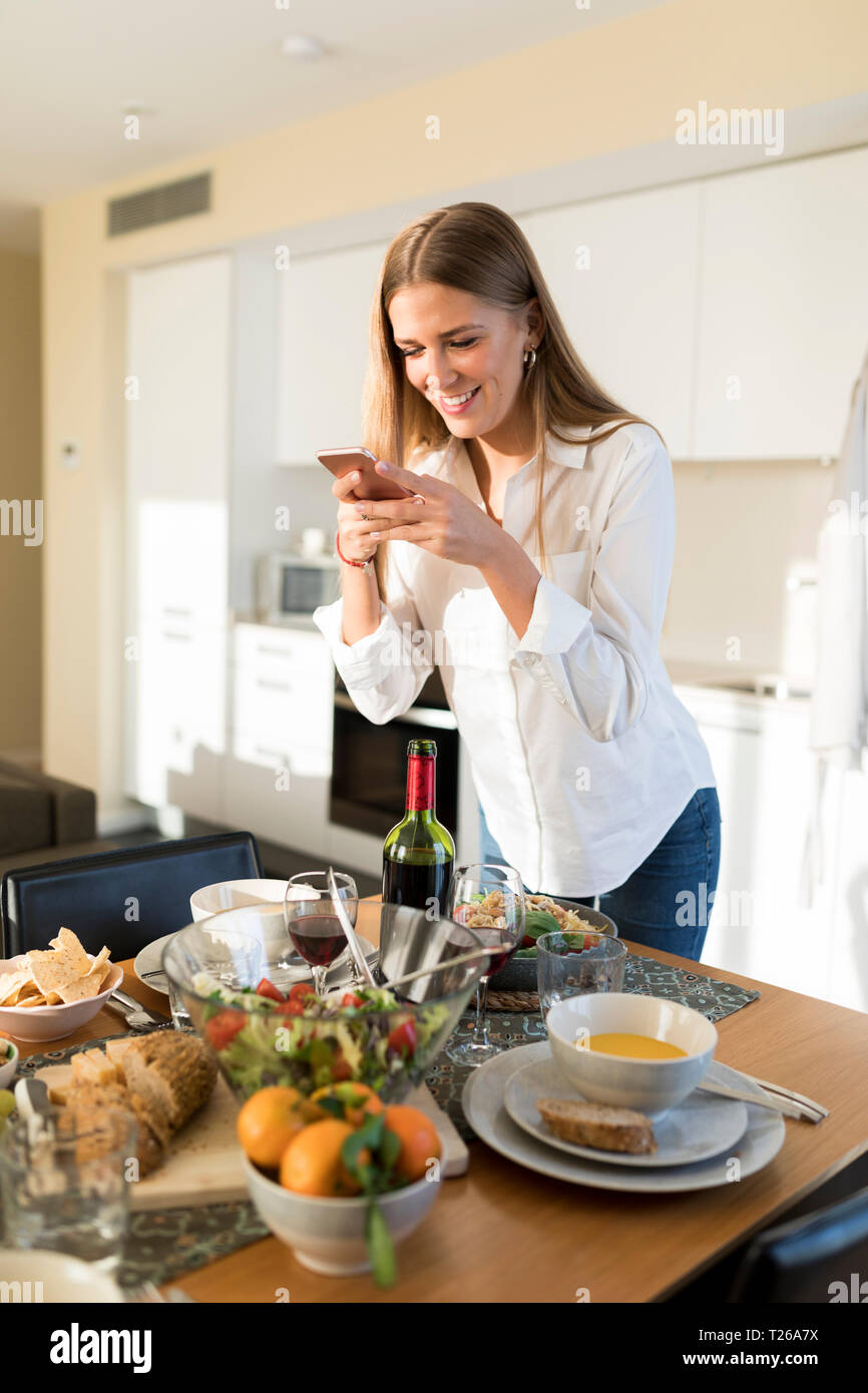 Woman taking pictures of the laid table for a lunch with friends Stock ...
