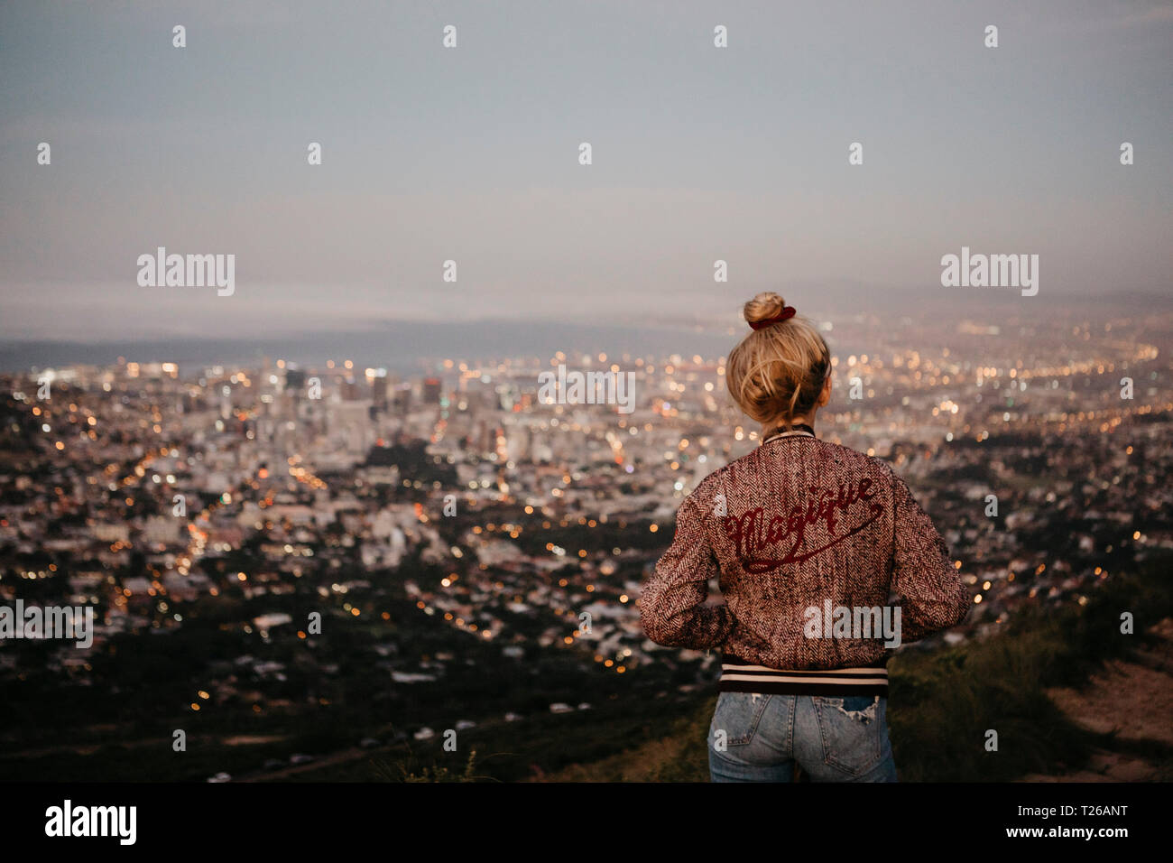 South Africa, Cape Town, Kloof Nek, woman woman looking at cityscape at ...
