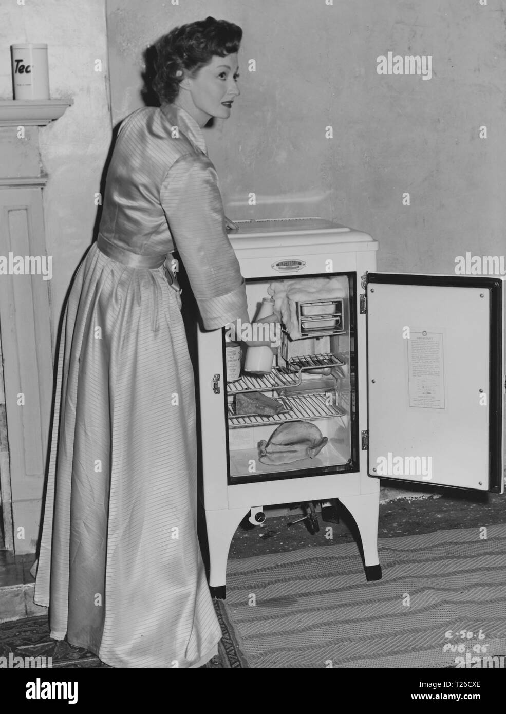 Taking milk from fridge Black and White Stock Photos & Images - Alamy