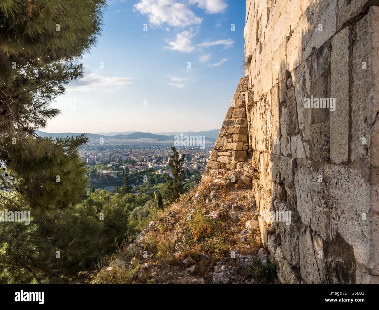 View of Athens from Acropolis with ancient wall and greenery against ...