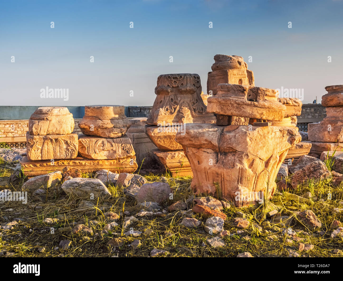 Ruins and parts of ancient columns, capitels and bases with Greek and ...