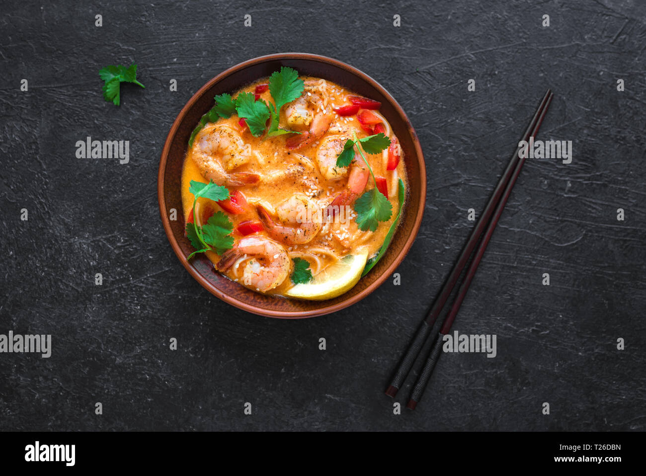 Laksa Shrimp Soup. Prawn noodle laksa soup on black background, top ...