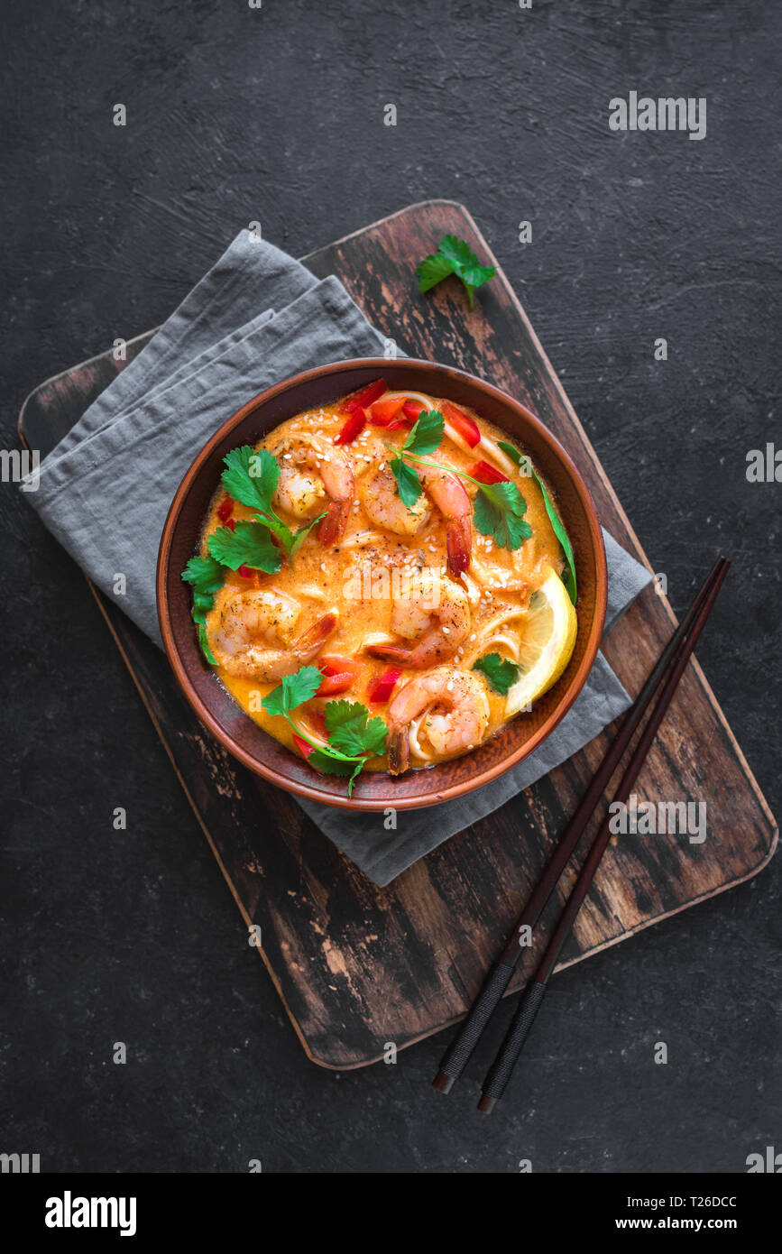 Laksa Shrimp Soup. Prawn noodle laksa soup on black background, top ...