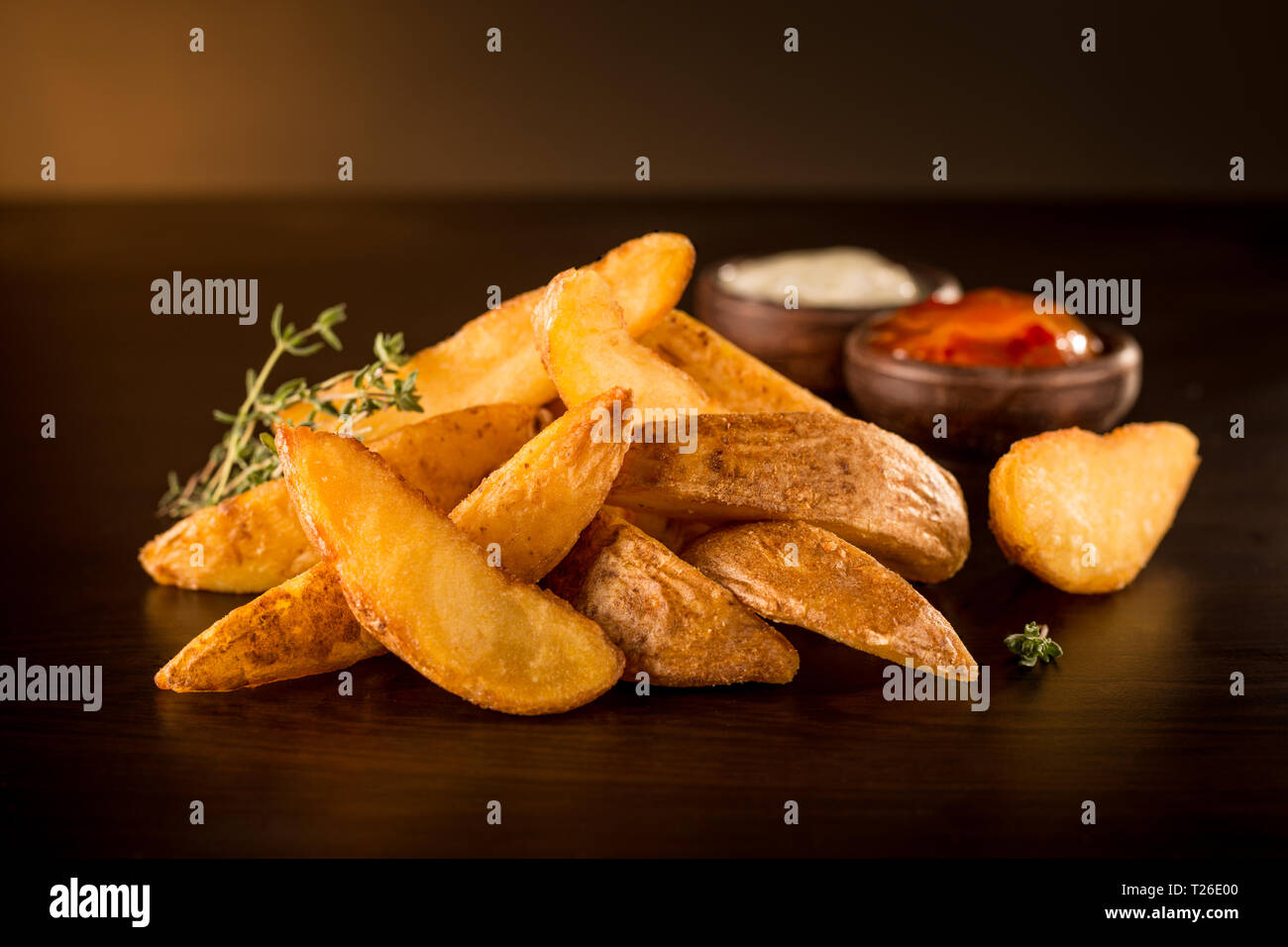 Rustic french fries with barbecue and mayonnaise Stock Photo - Alamy