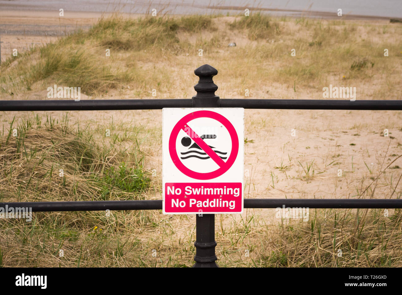 No swimming or paddling on the beach sign Stock Photo - Alamy
