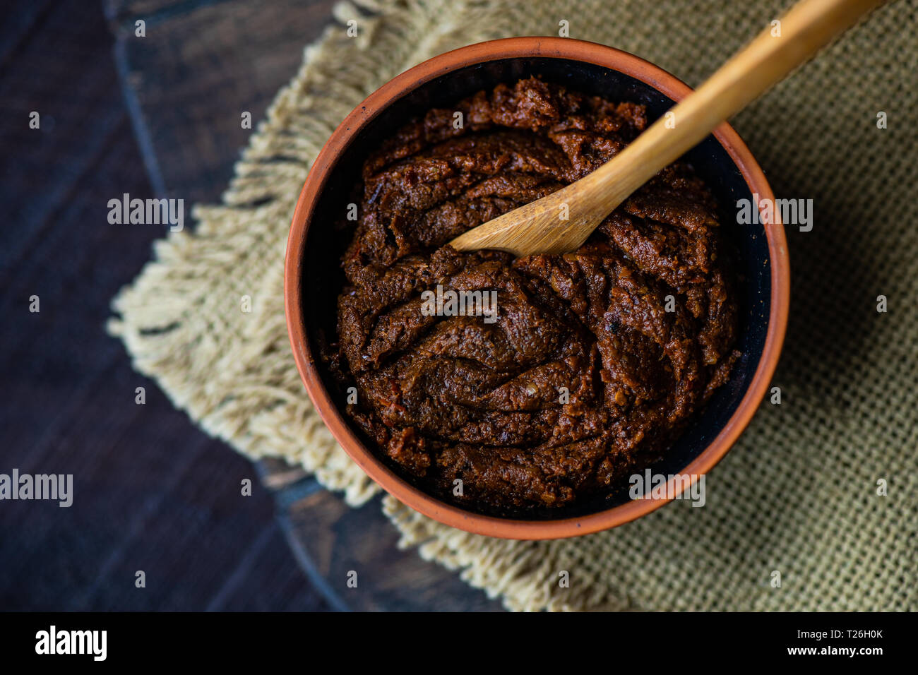 Traditional georgian sauce spicy ajika on rustic background with copy ...