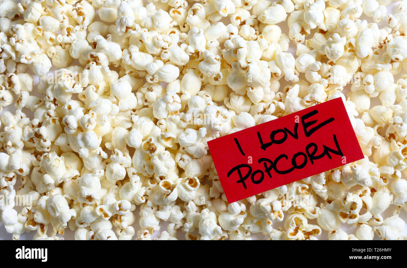 Popcorn background. Top view. Tag I love popcorn Stock Photo - Alamy