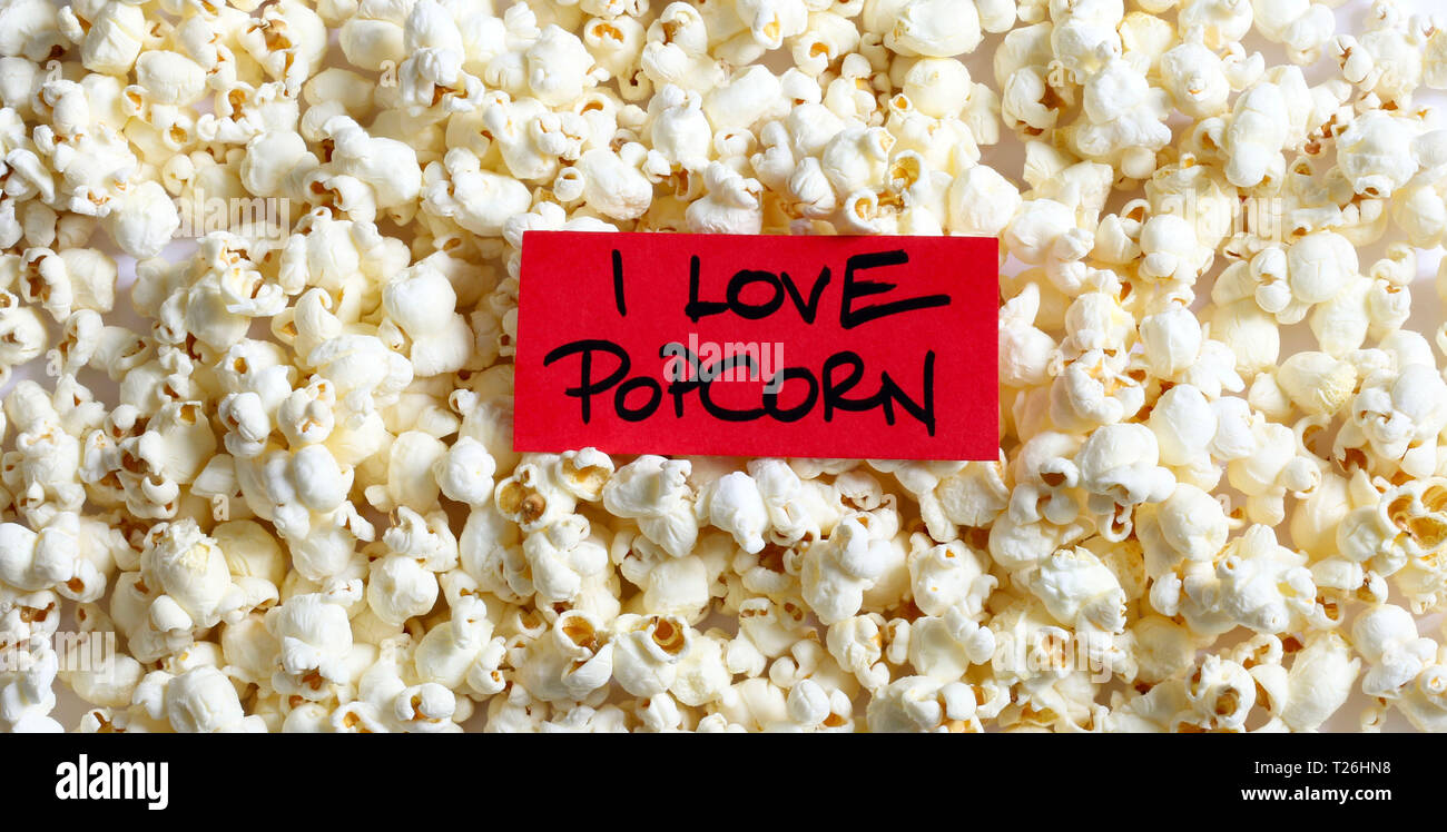 Popcorn background. Top view. Tag I love popcorn Stock Photo - Alamy