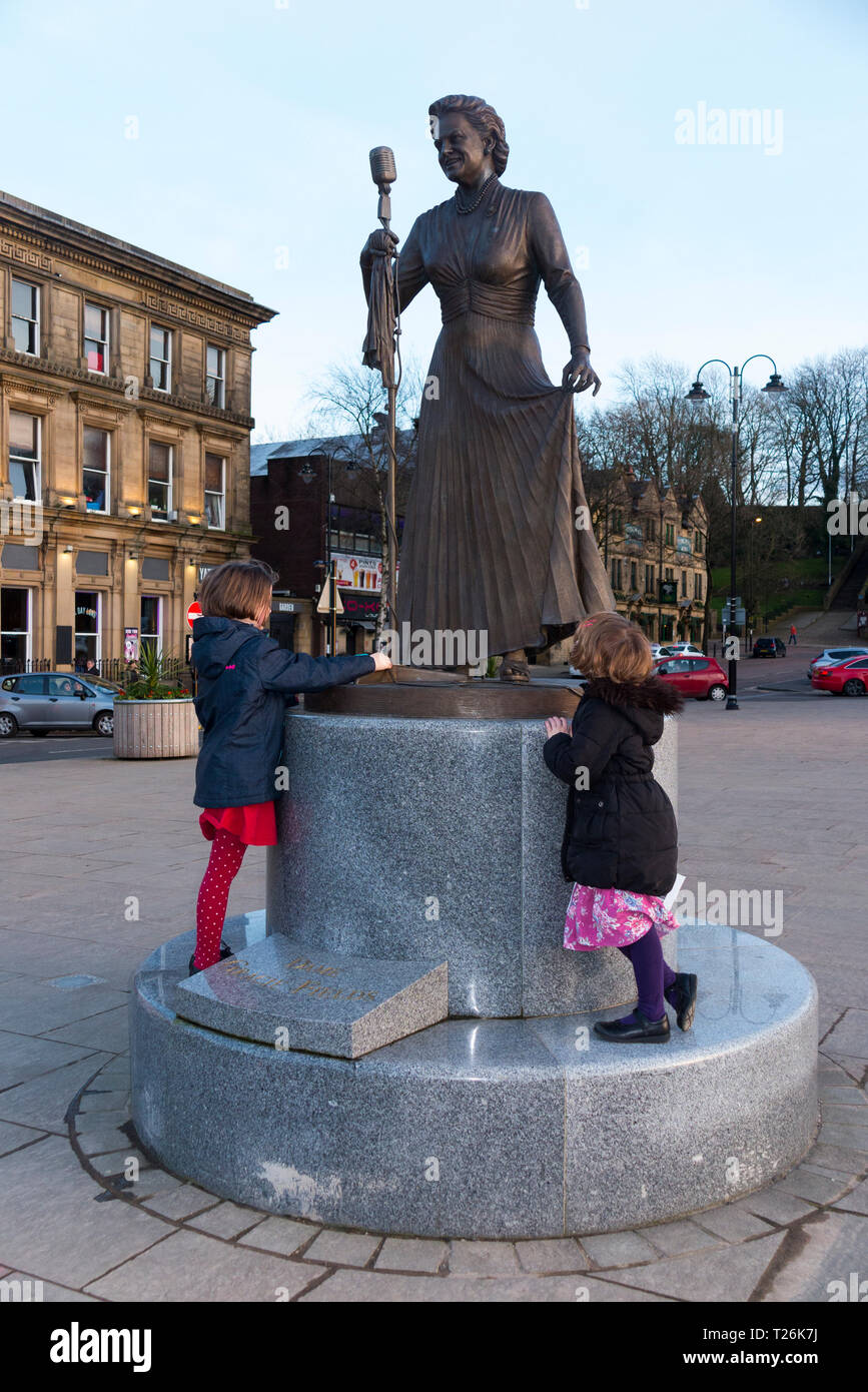 Two children / kids / girls admire the statue of Dame Gracie Fields ...