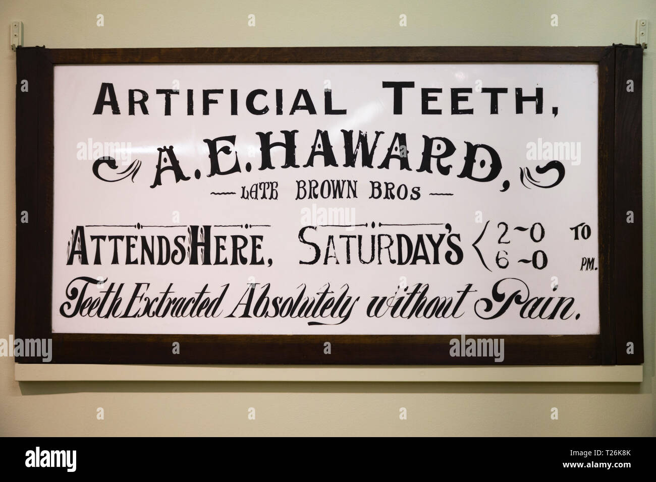 Old historical marketing sign for false teeth and painless / pain less ...