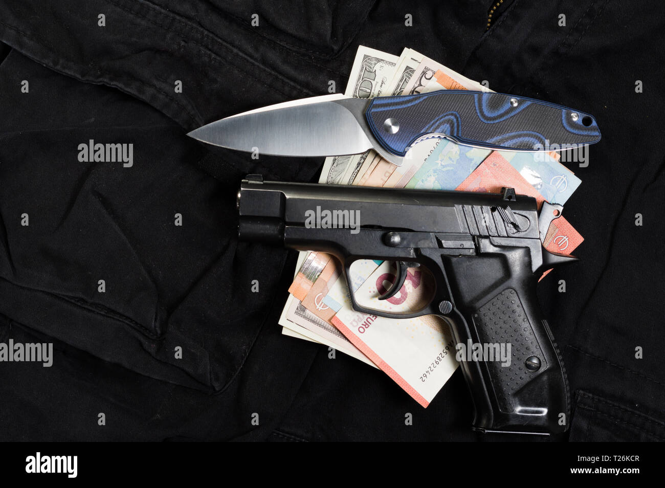 Black market weapons. Sale of illegal weapons. Top view of the money ...