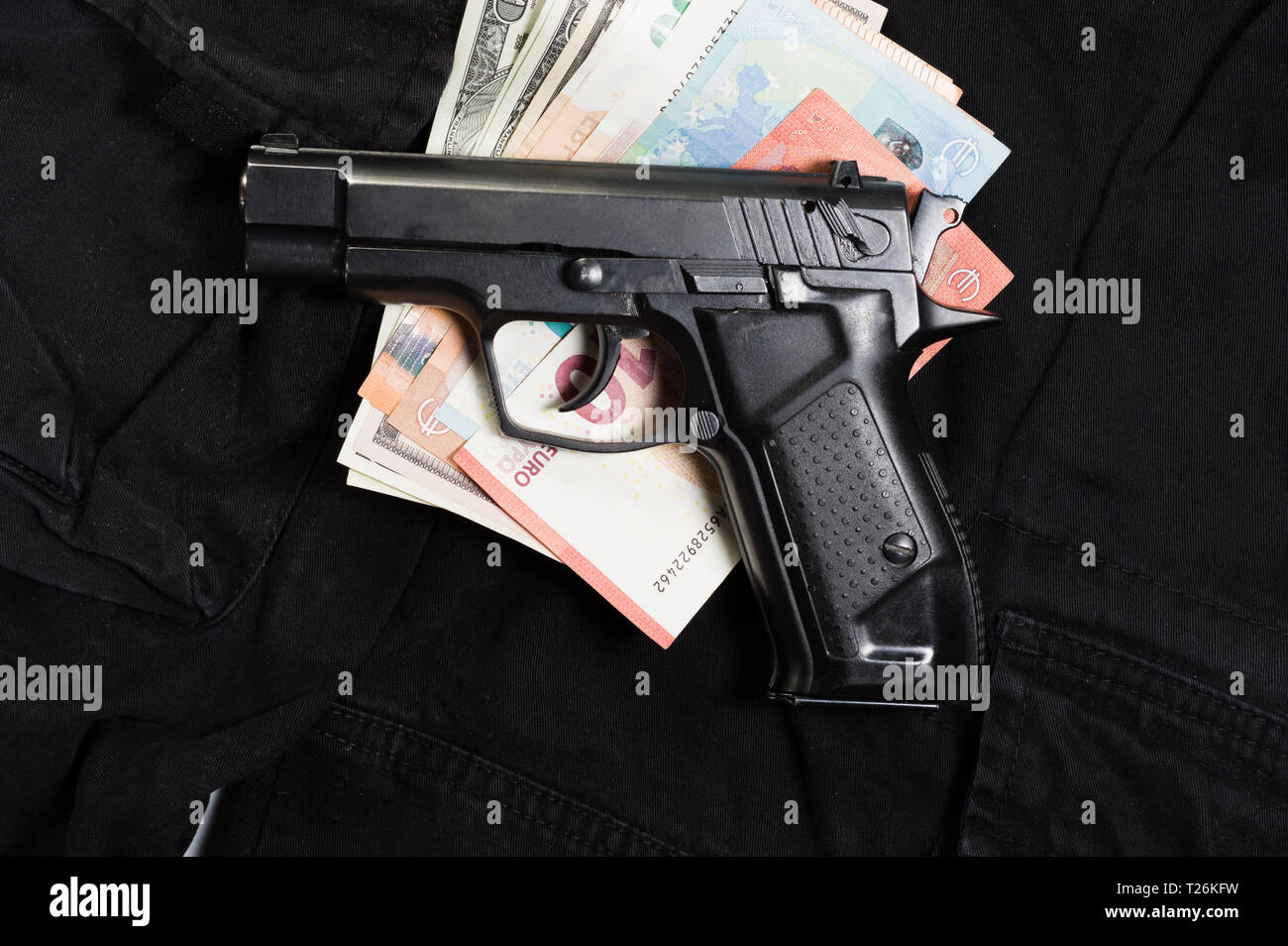 Currency and weapons hi-res stock photography and images - Alamy
