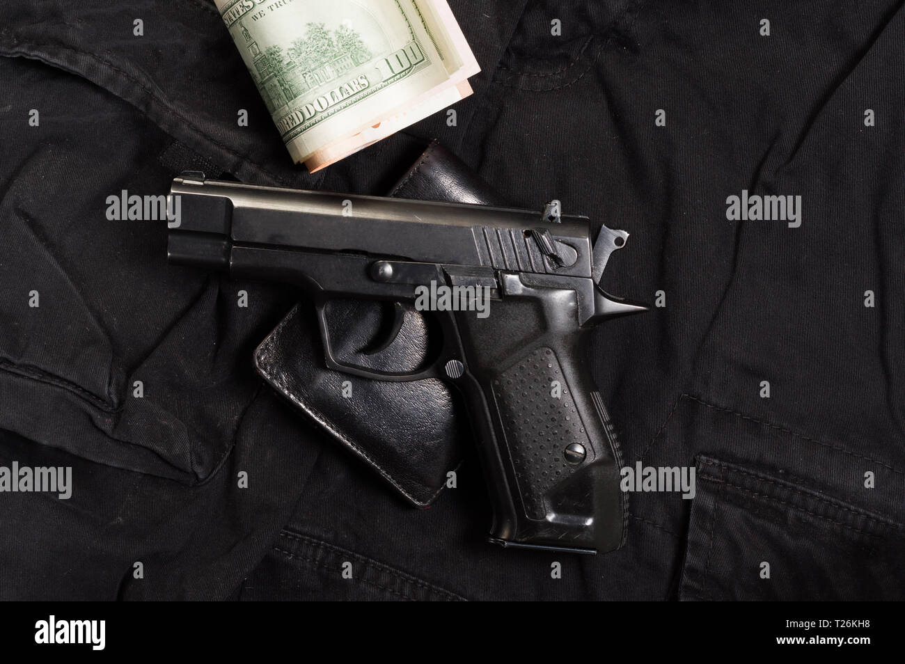 Pistol, wallet and money. Buying a weapon. Top view on money Stock ...