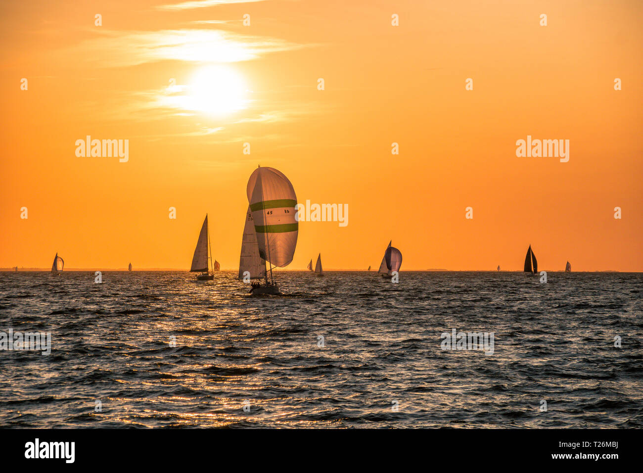 Sailing at sunset Stock Photo - Alamy