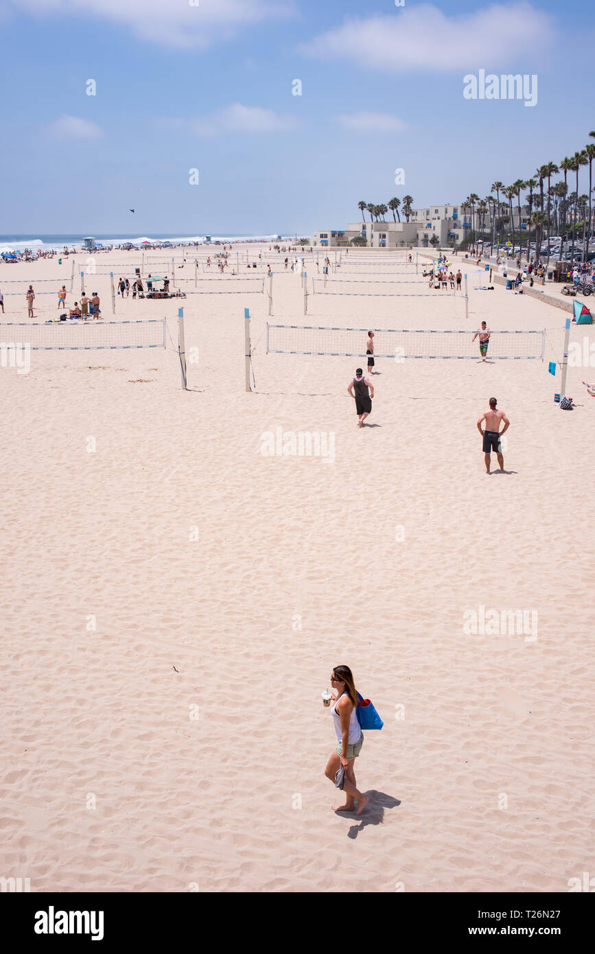 A sunny summer day on Huntington Beach brings a variety of people out ...
