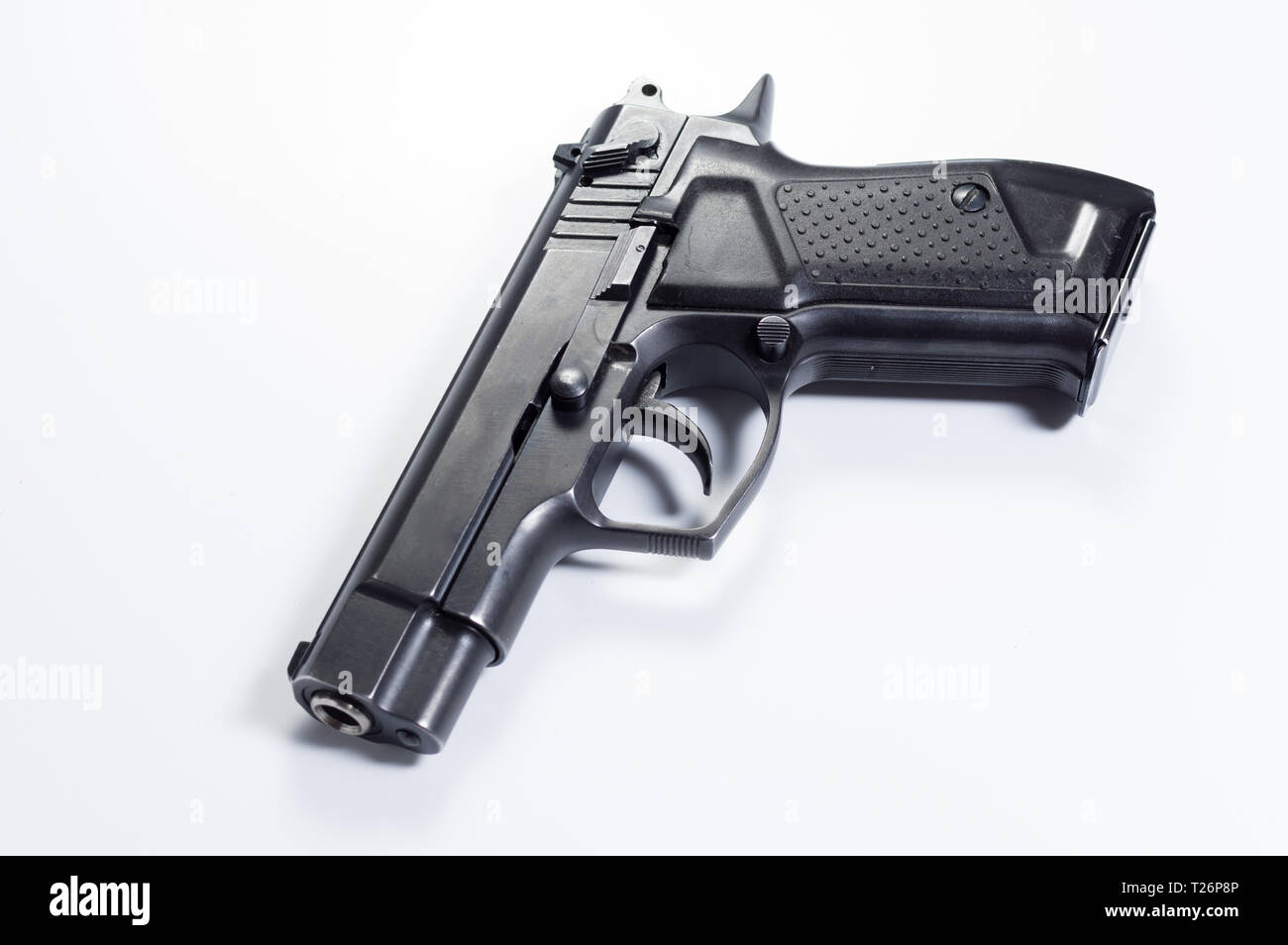 Fire pistol at an angle. Pistol on a gray background. Isolate Stock ...