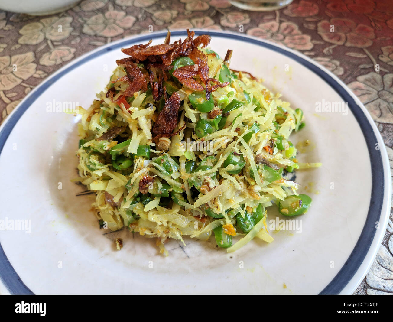 Lawar, a traditional dish from Bali. Green bean salad with chicken ...