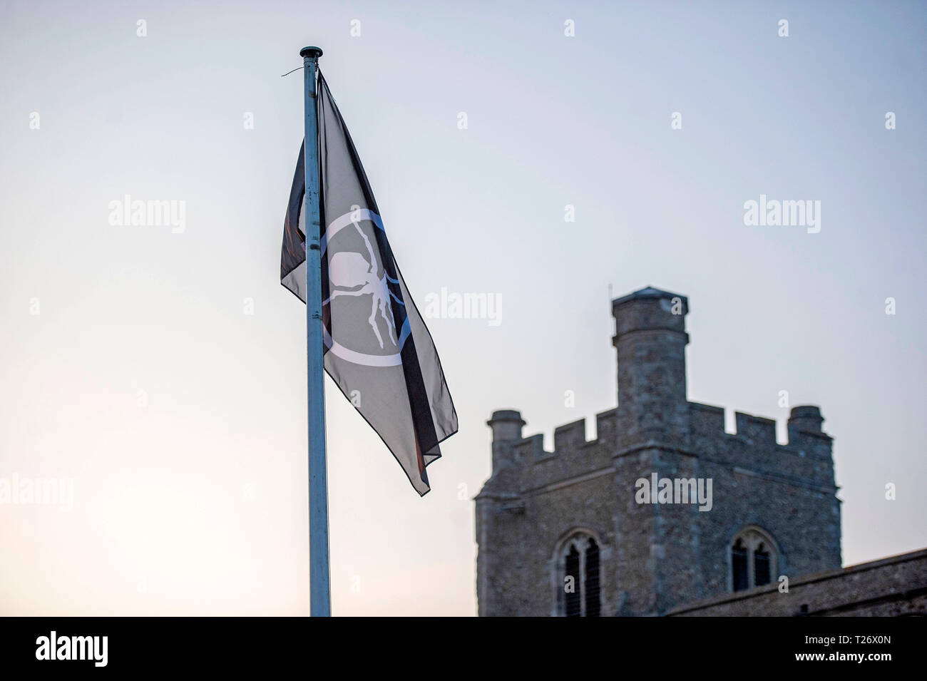 Essex, UK. 30th March 2019. A Prodigy flag outside the church during ...