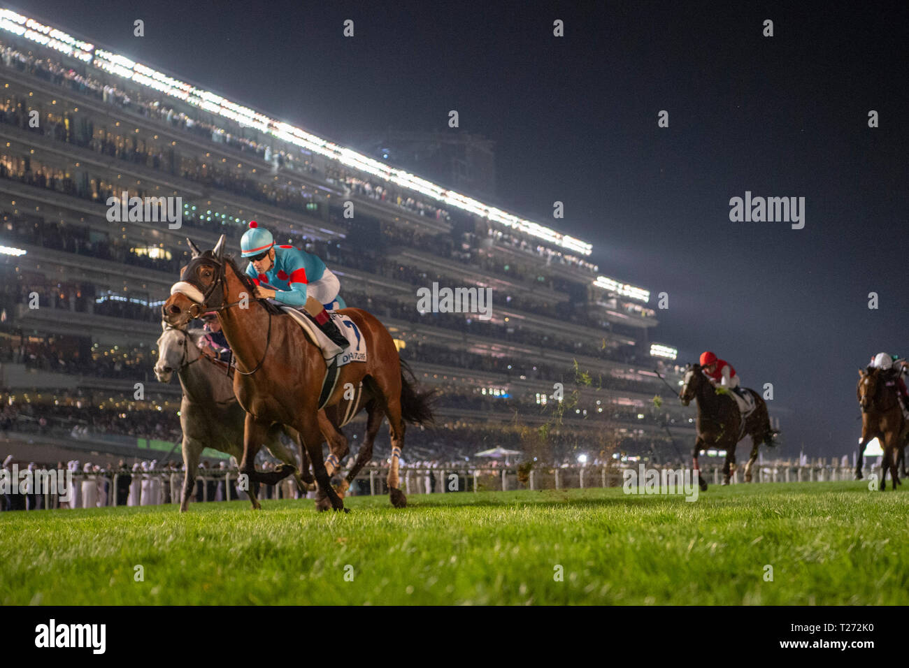 Dubai, UAE. 30th Mar, 2019. Almond Eye, ridden by Christophe Lemaire ...