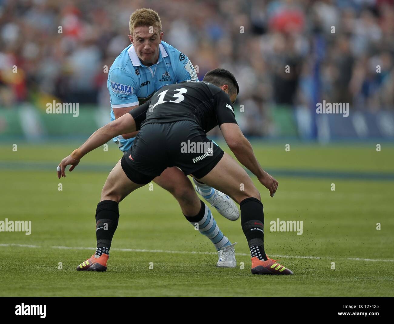 London, UK. 30th March 2019. Kyle Steyn (Glasgow Warriers) is tackled ...
