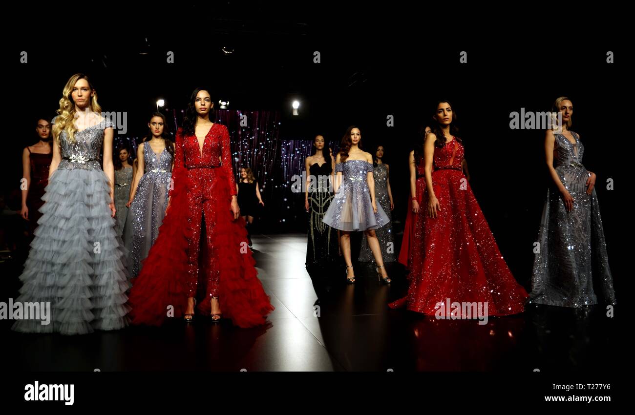 Amman, Jordan. 30th Mar, 2019. Models present creations on a show of ...