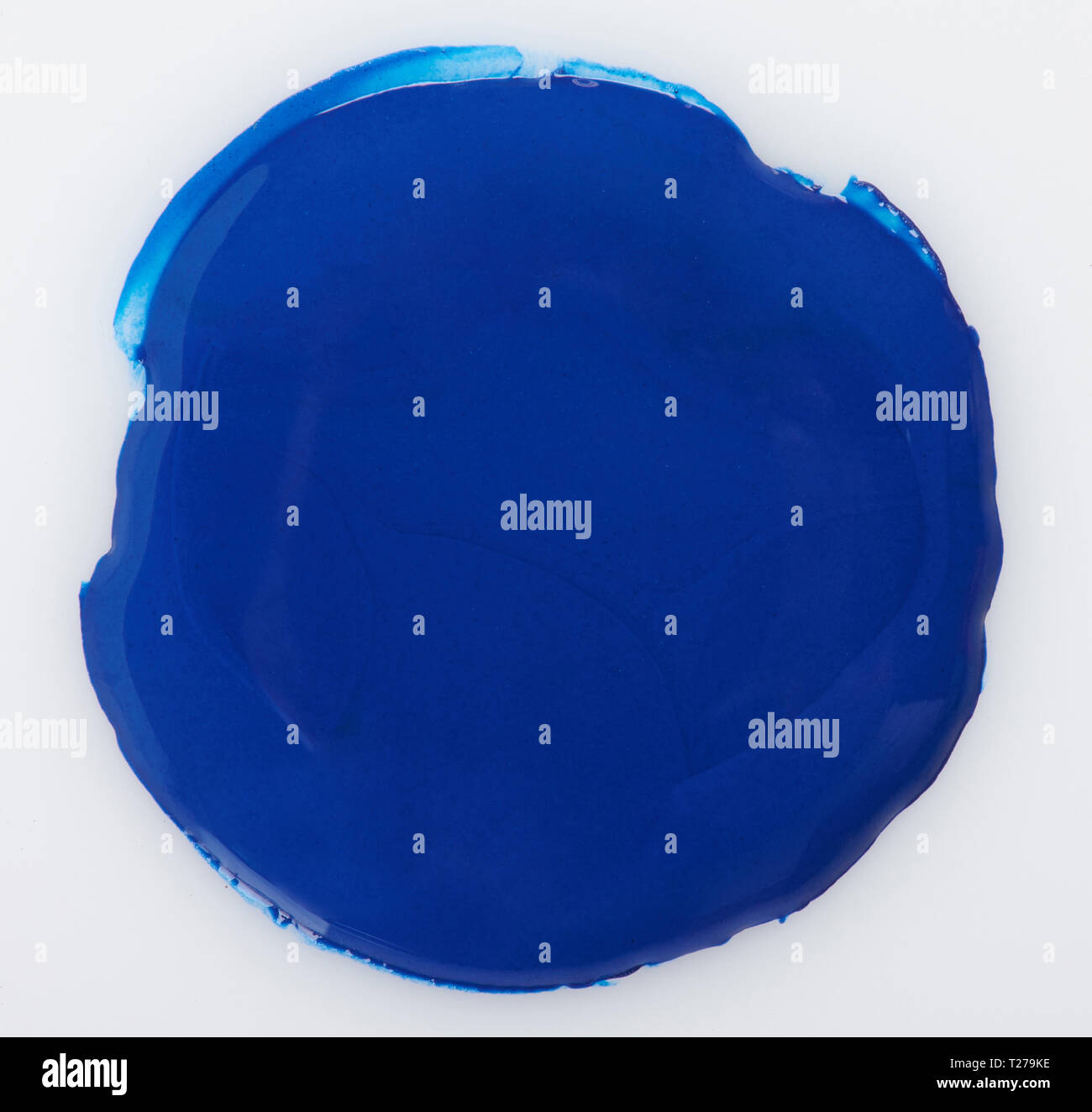 Blue paint drop isolated on white paper background close up macro view ...