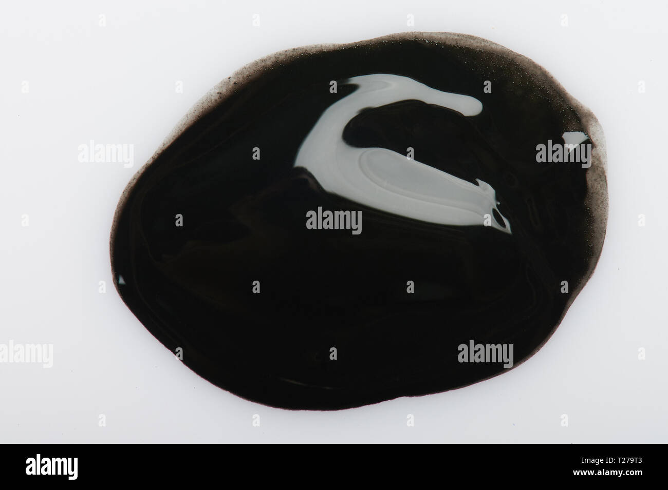 Black ink paint drop on white paper background Stock Photo - Alamy
