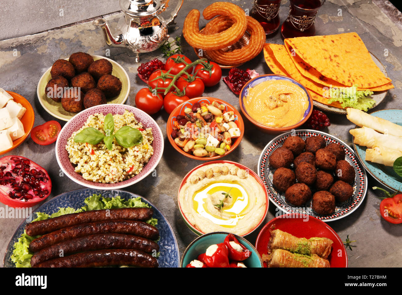 Middle eastern or arabic dishes and assorted meze, concrete rustic ...