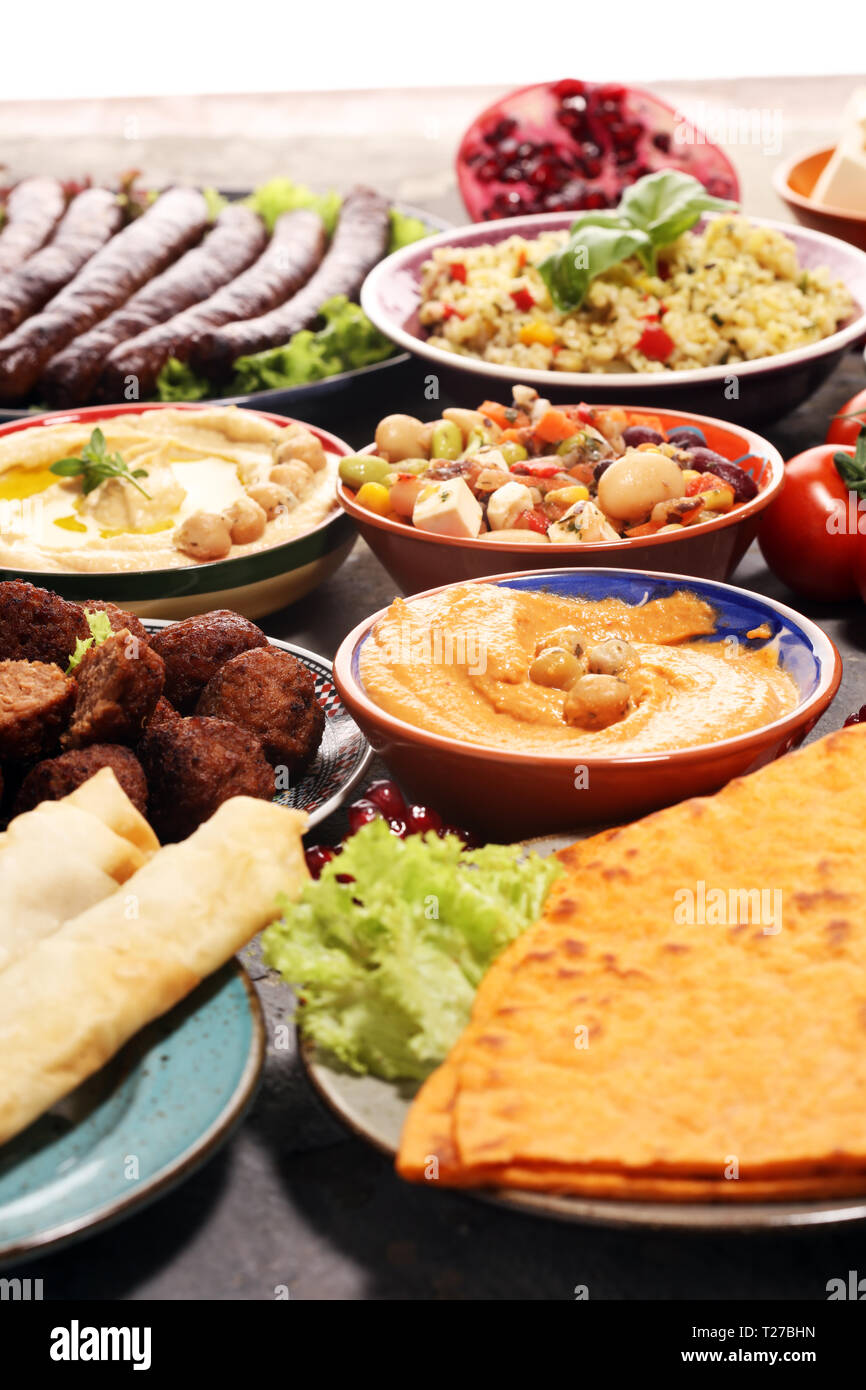Middle eastern or arabic dishes and assorted meze, concrete rustic ...