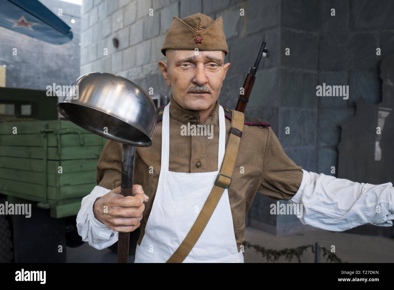 A soldier cook serving grub, food in an exhibit at the Great Patriotic ...