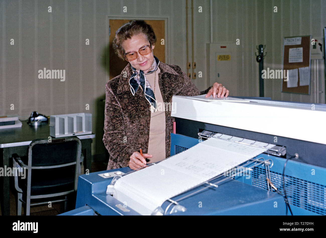 Mrs. Katherine G. Johnson at Work looking at a computer printout at ...