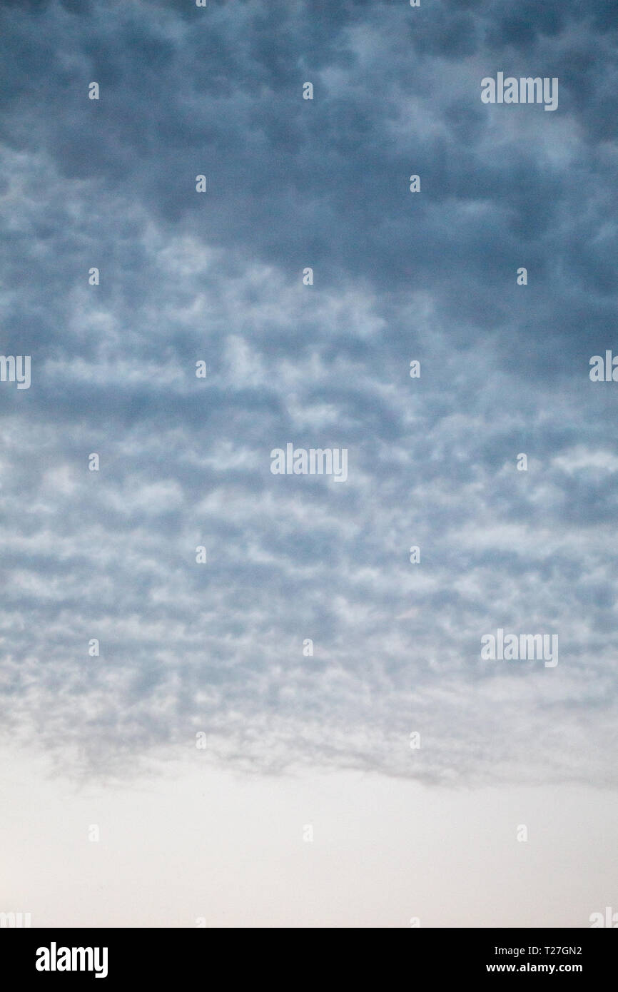 Grey color clouds partly cover the sky in the daytime Stock Photo - Alamy