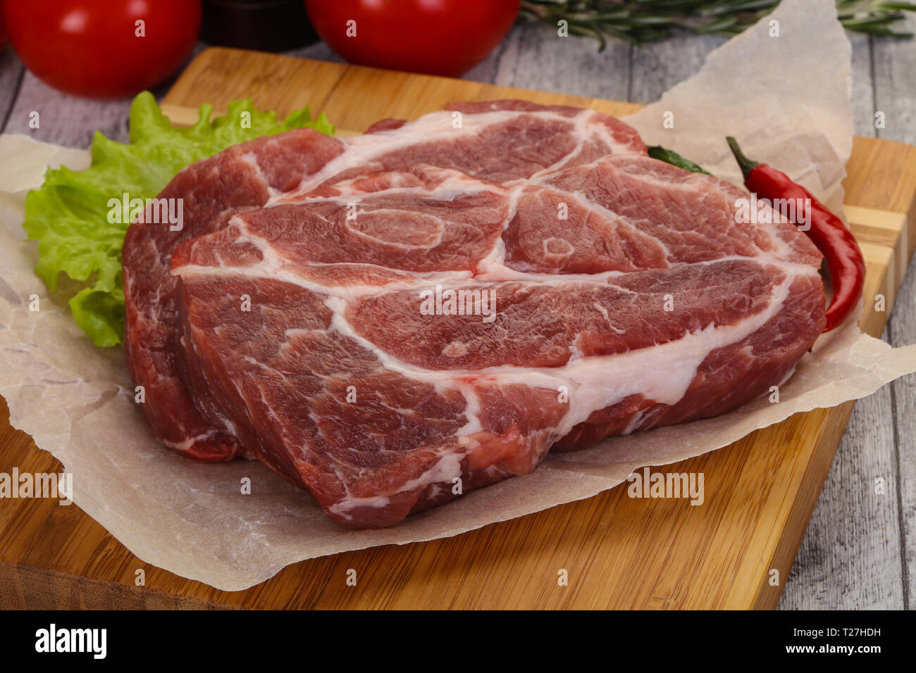 Raw pork neck steak ready for cooking Stock Photo - Alamy