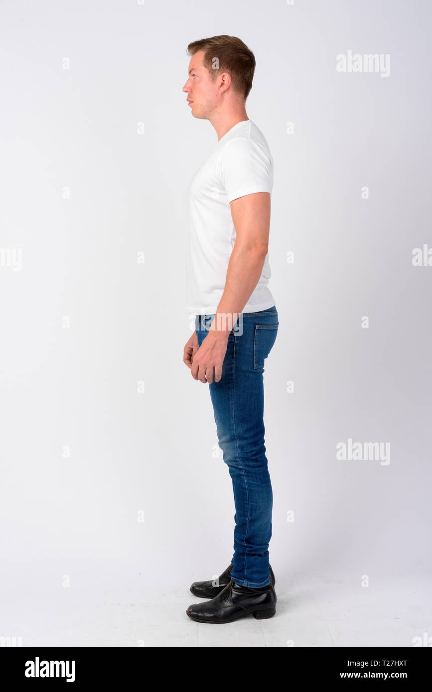 Full body shot profile view of young handsome man Stock Photo - Alamy