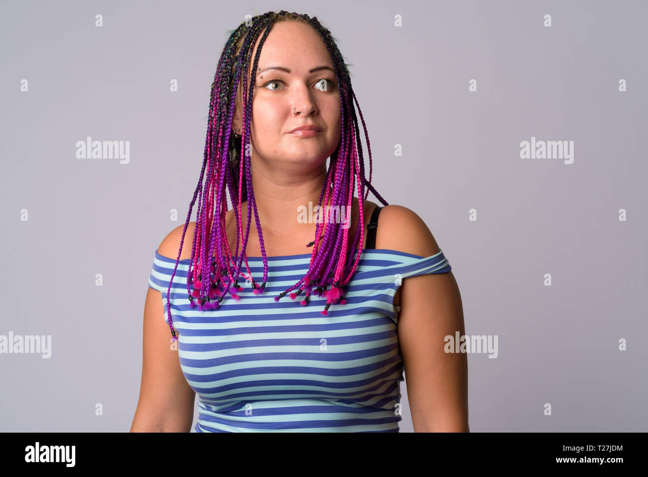 Portrait of rebellious woman with dreadlocks thinking Stock Photo - Alamy